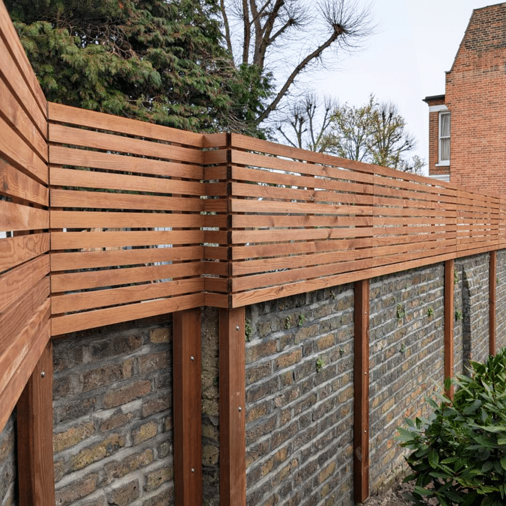 The Planks On Wall Fence New Fence Installation On Retaining Wall